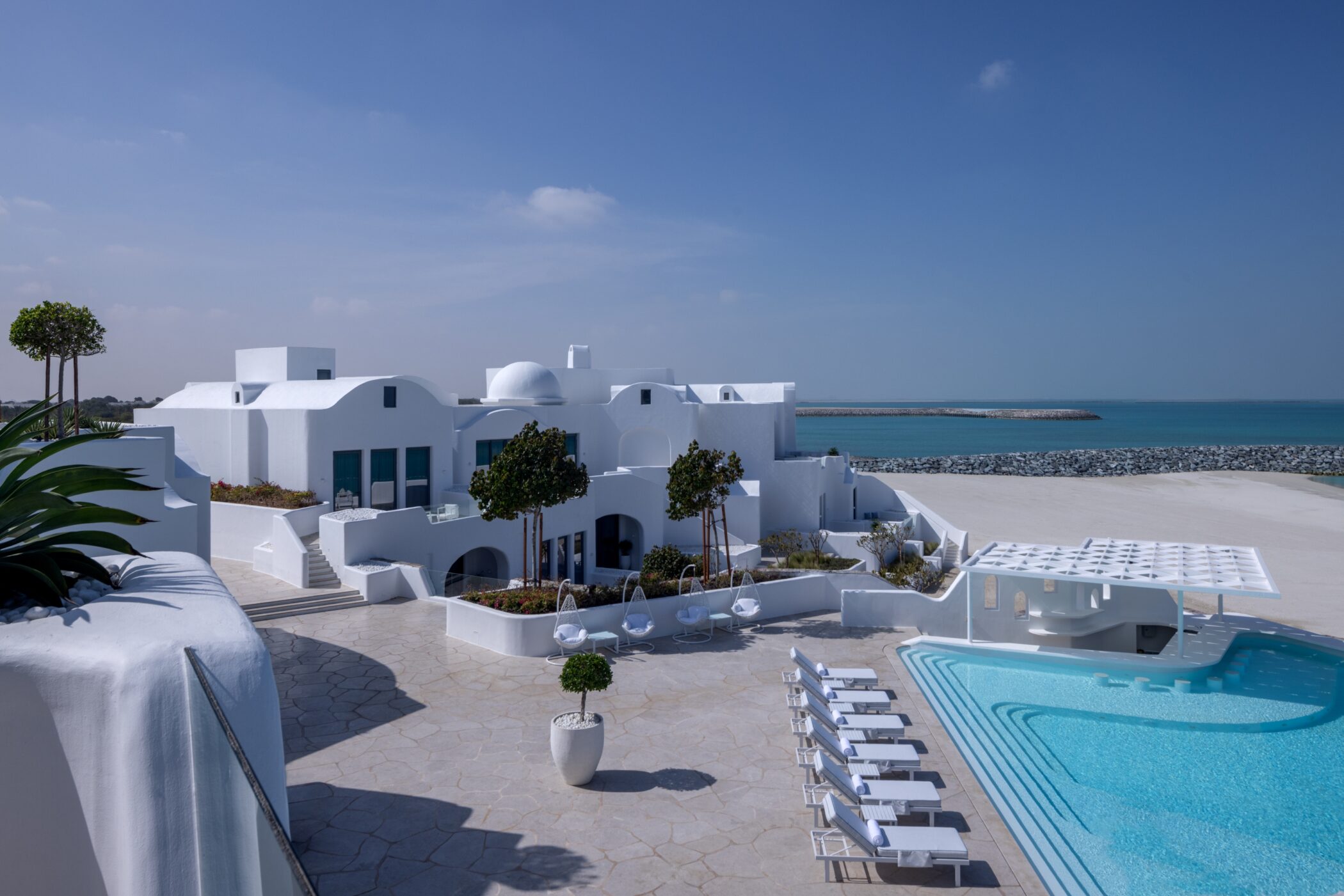 Anantara Santorini Abu Dhabi Retreat - Exterior Pool Beach View ⋆ Globetrender